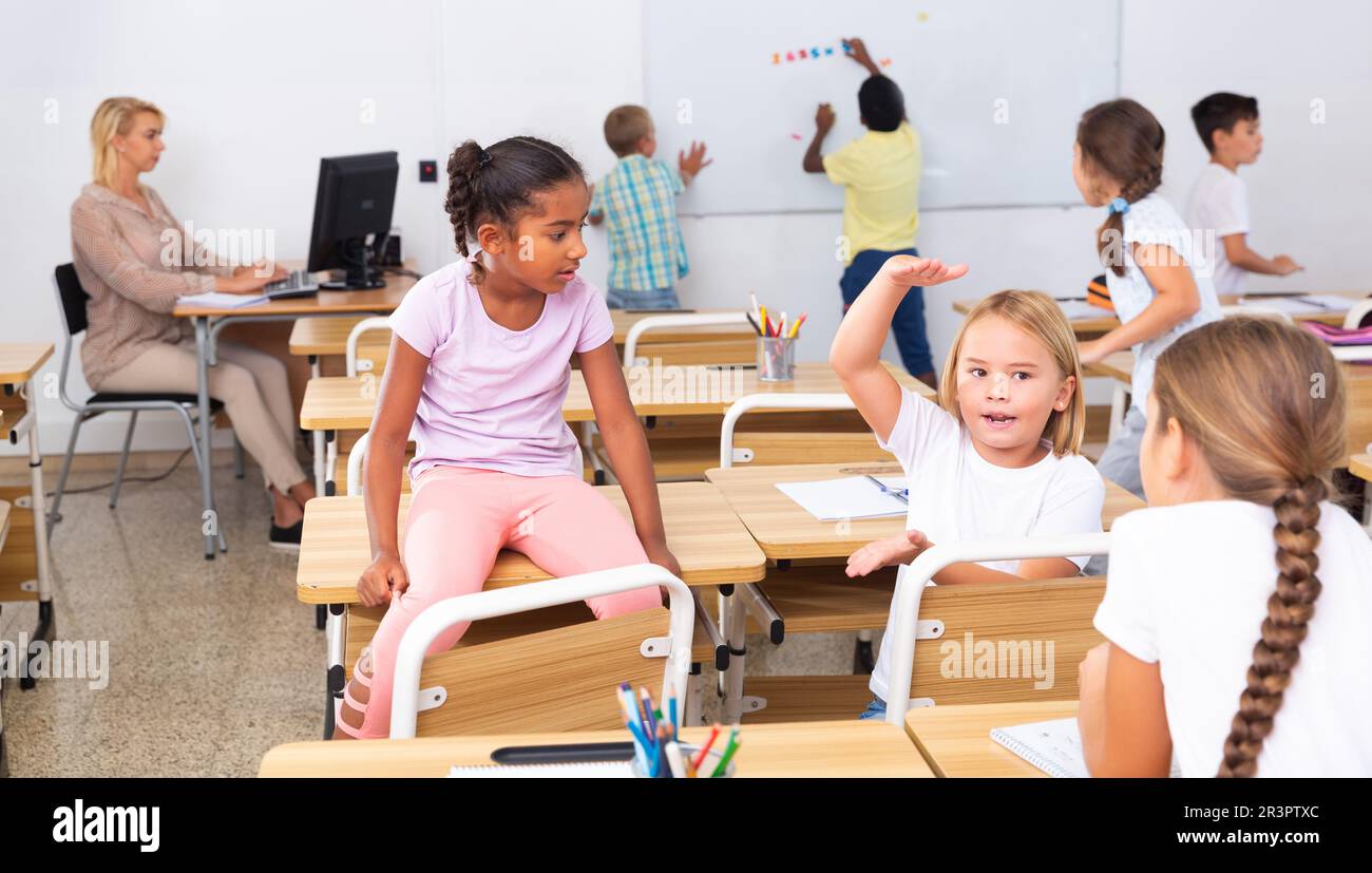 Children pupils talking during recess between lessons Stock Photo - Alamy