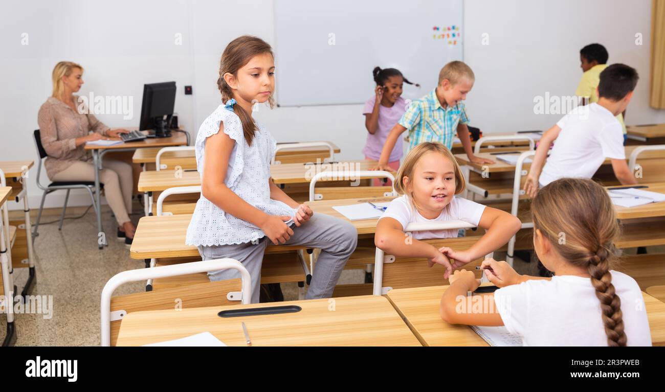 Kids pupils talking during recess between lessons Stock Photo - Alamy