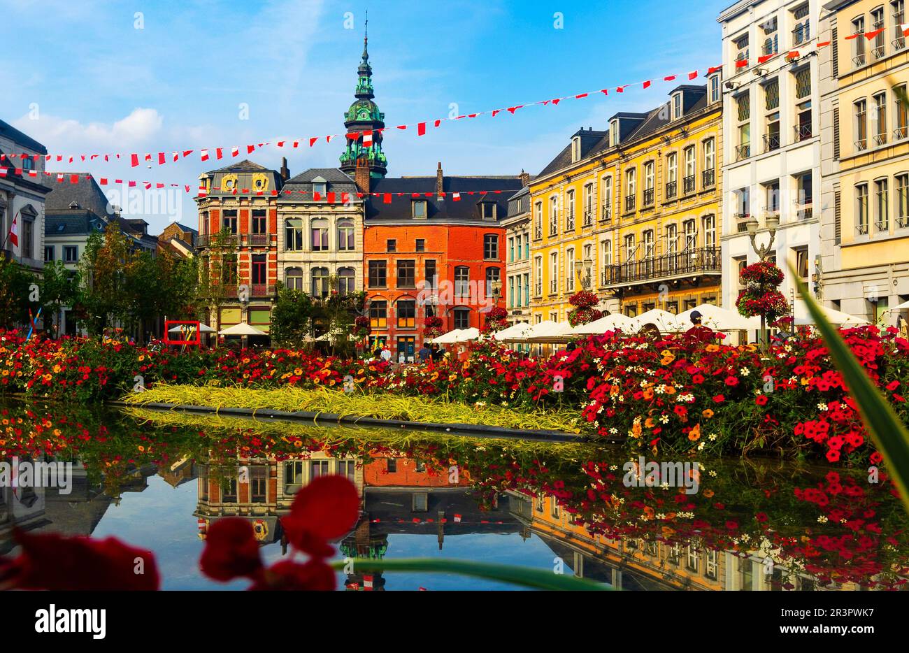 Summer view of Grand Place square with belfry of Church of St ...