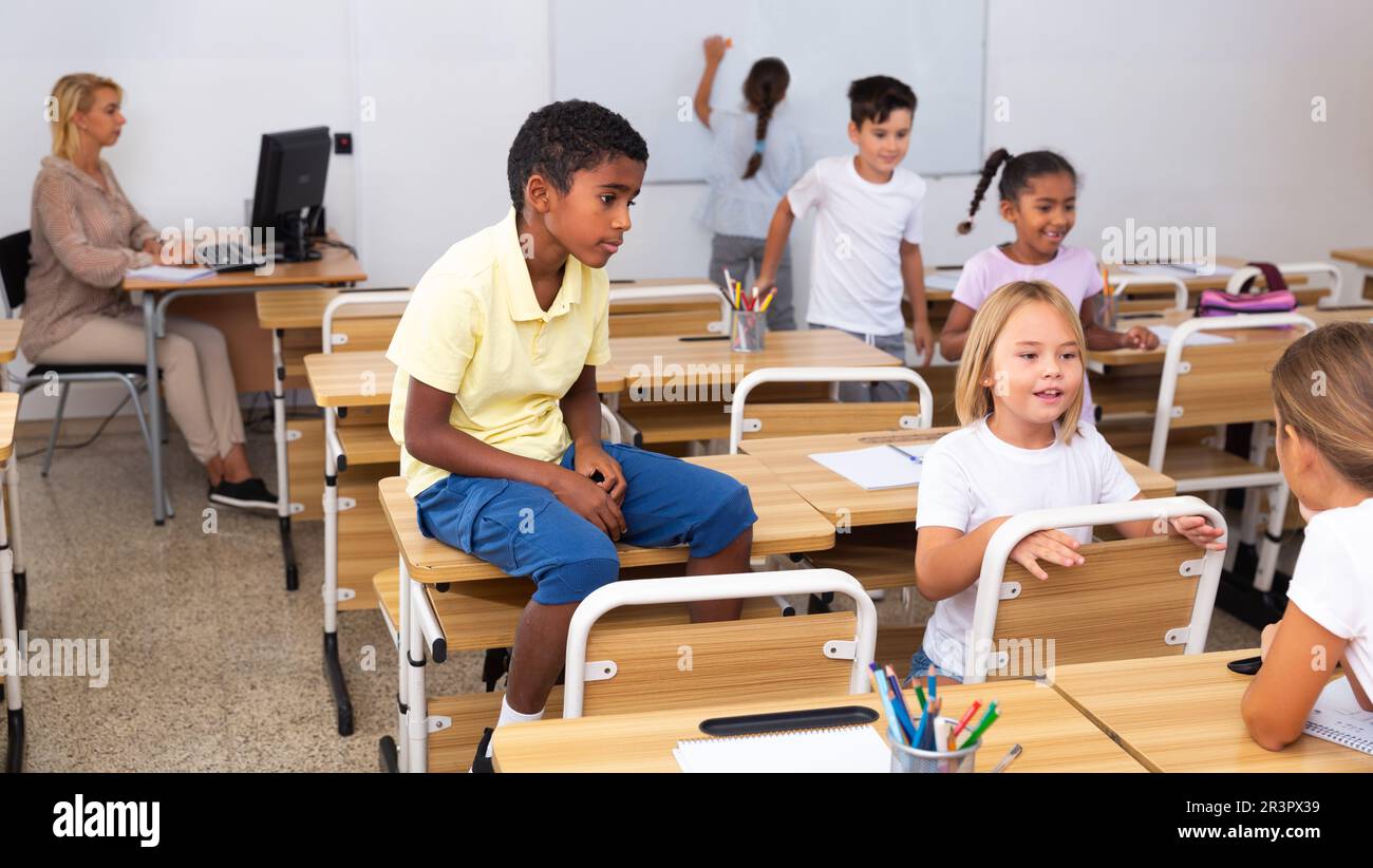 Children pupils talking during recess between lessons Stock Photo - Alamy