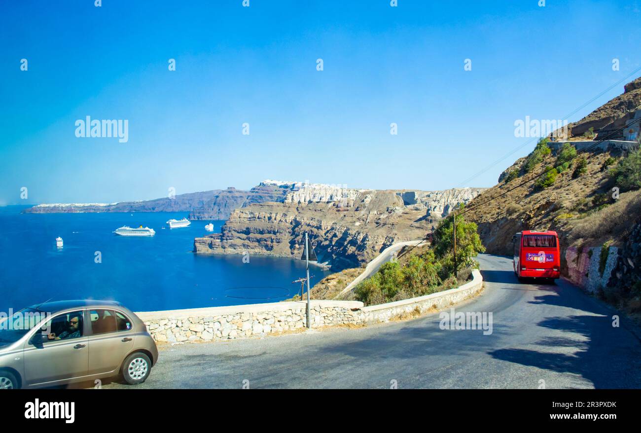 Vehicles moving on narrow winding road to Thira Santorini port,Port ...