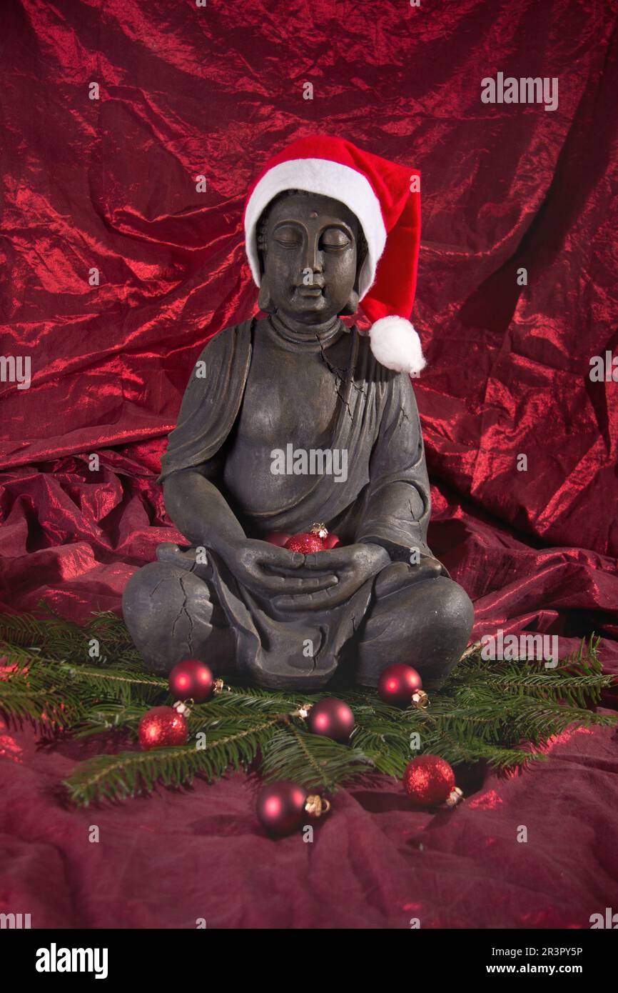 buddha statue with Santa Claus cap and Christmas decorations Stock ...