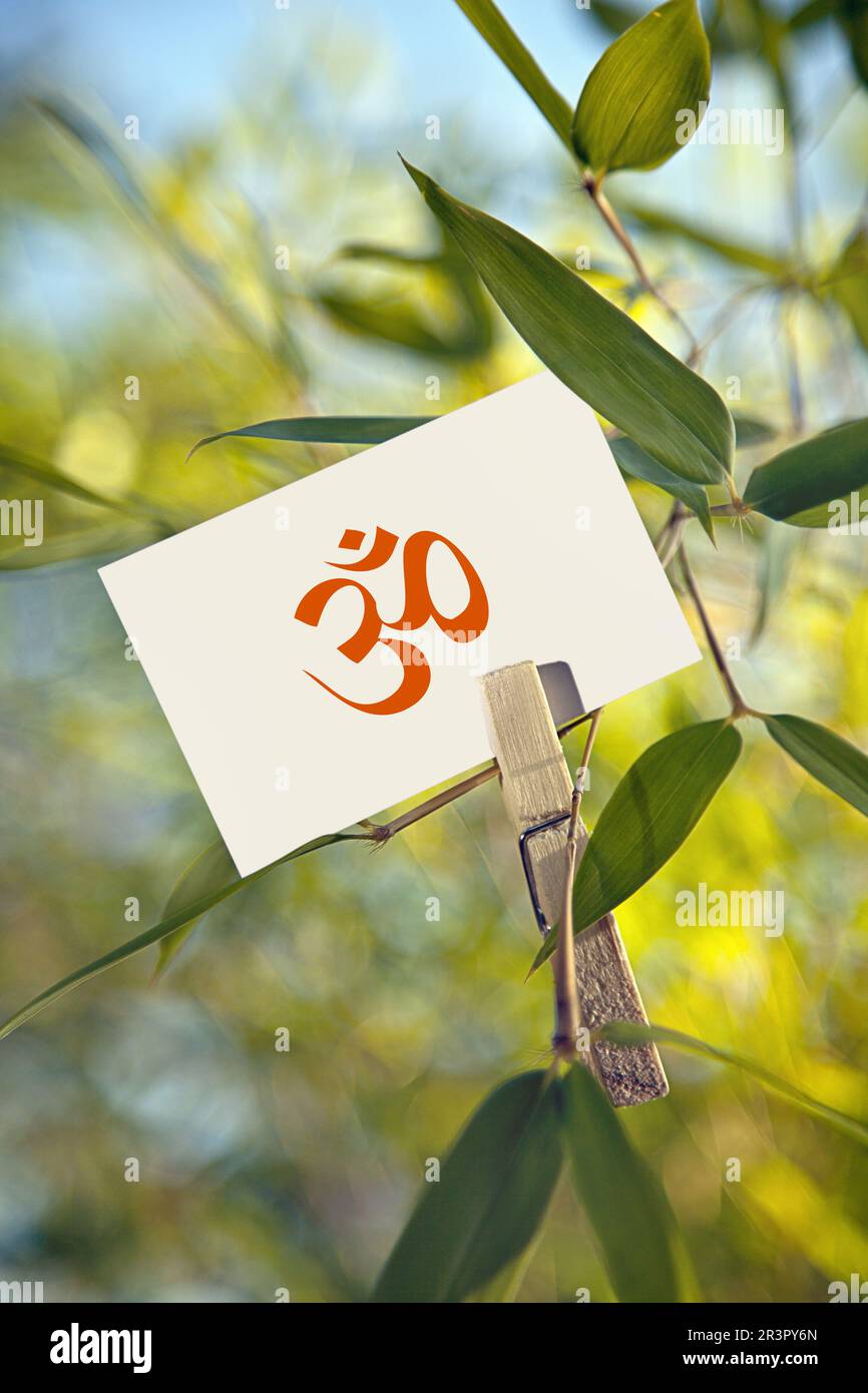 memo sheet at a bamboo with om symbol Stock Photo - Alamy