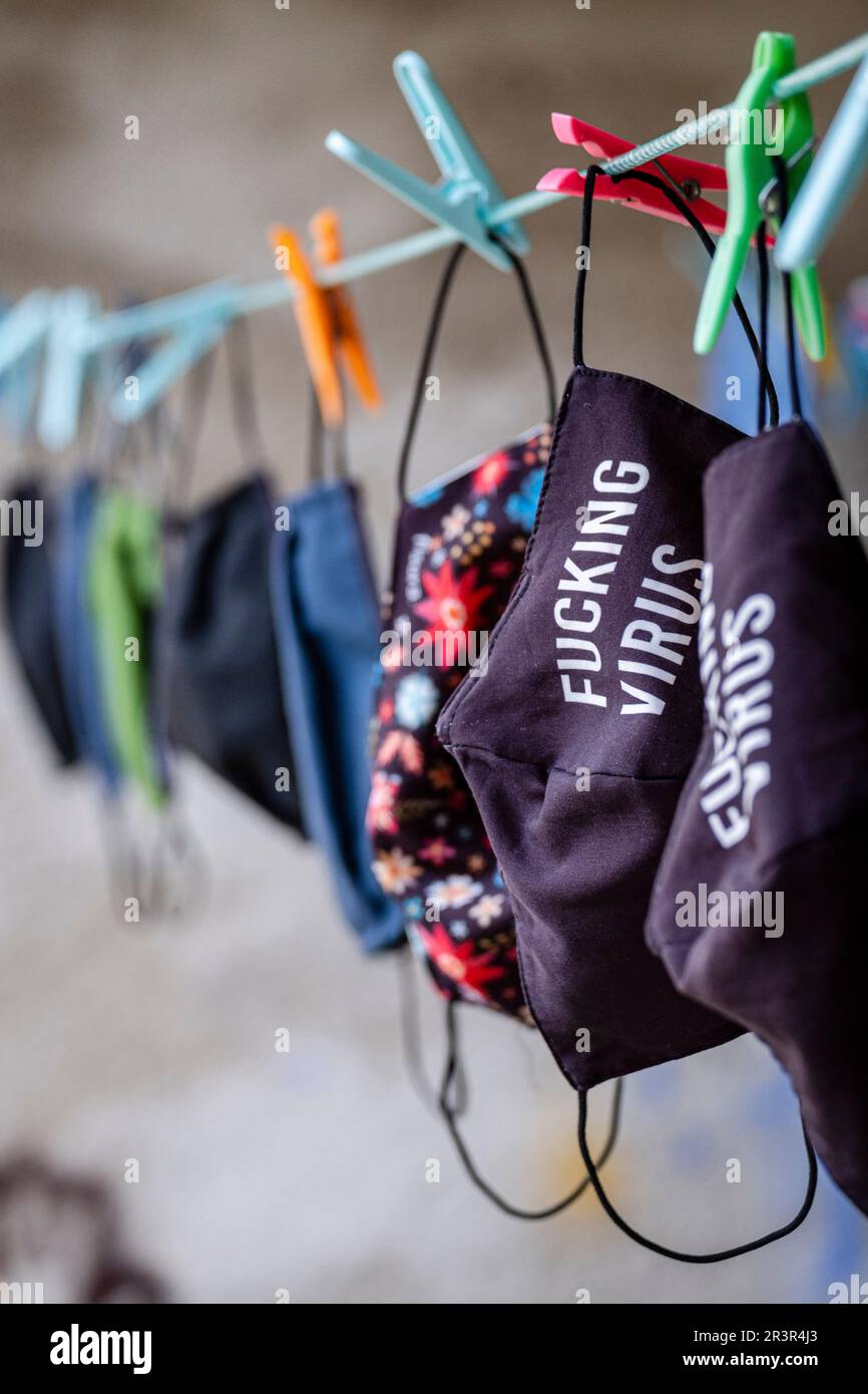 laundry of anti-virus masks hanging in a dryer Stock Photo - Alamy