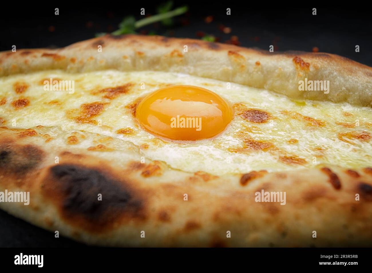 baked khachapuri with egg and cheese, up close Stock Photo - Alamy