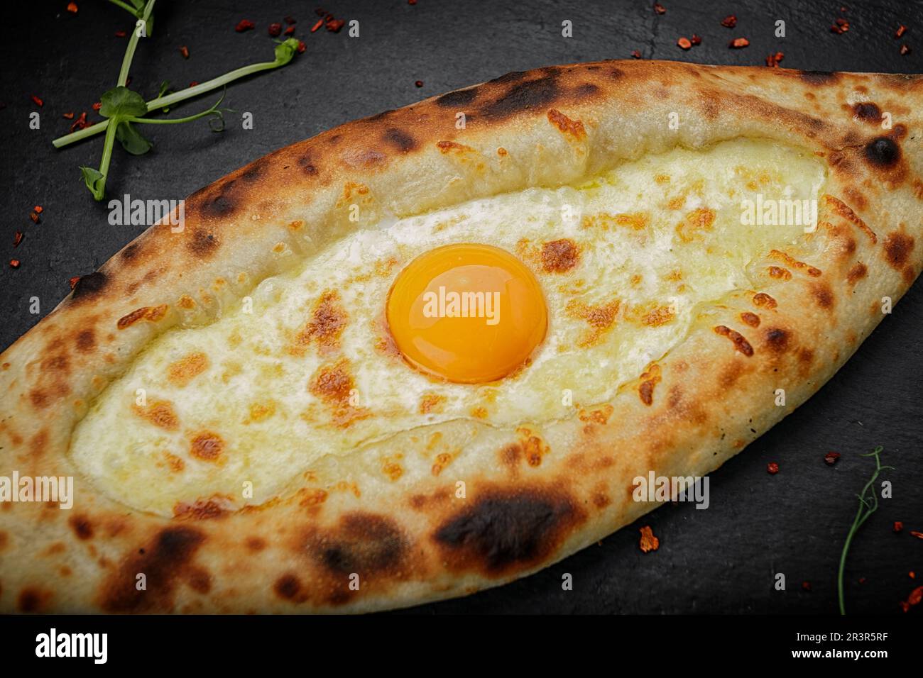 baked khachapuri with egg and cheese, up close Stock Photo - Alamy