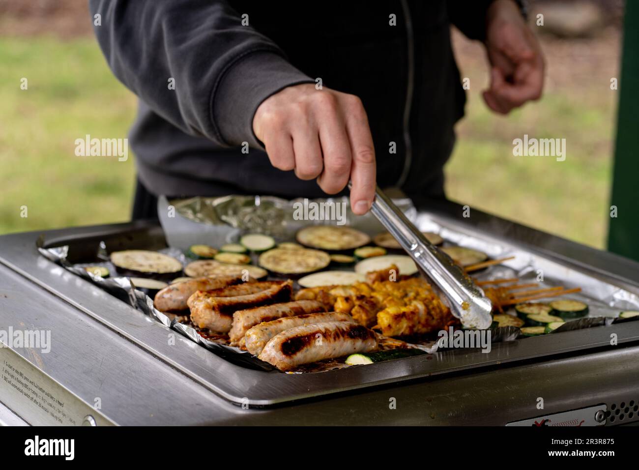 Cooking Barbecue in a public park Stock Photo - Alamy