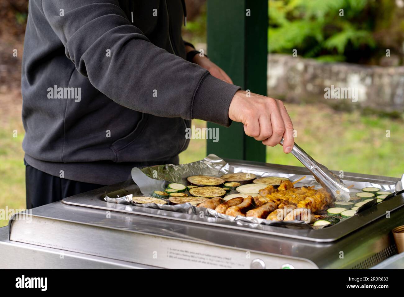 Cooking Barbecue in a public park Stock Photo - Alamy