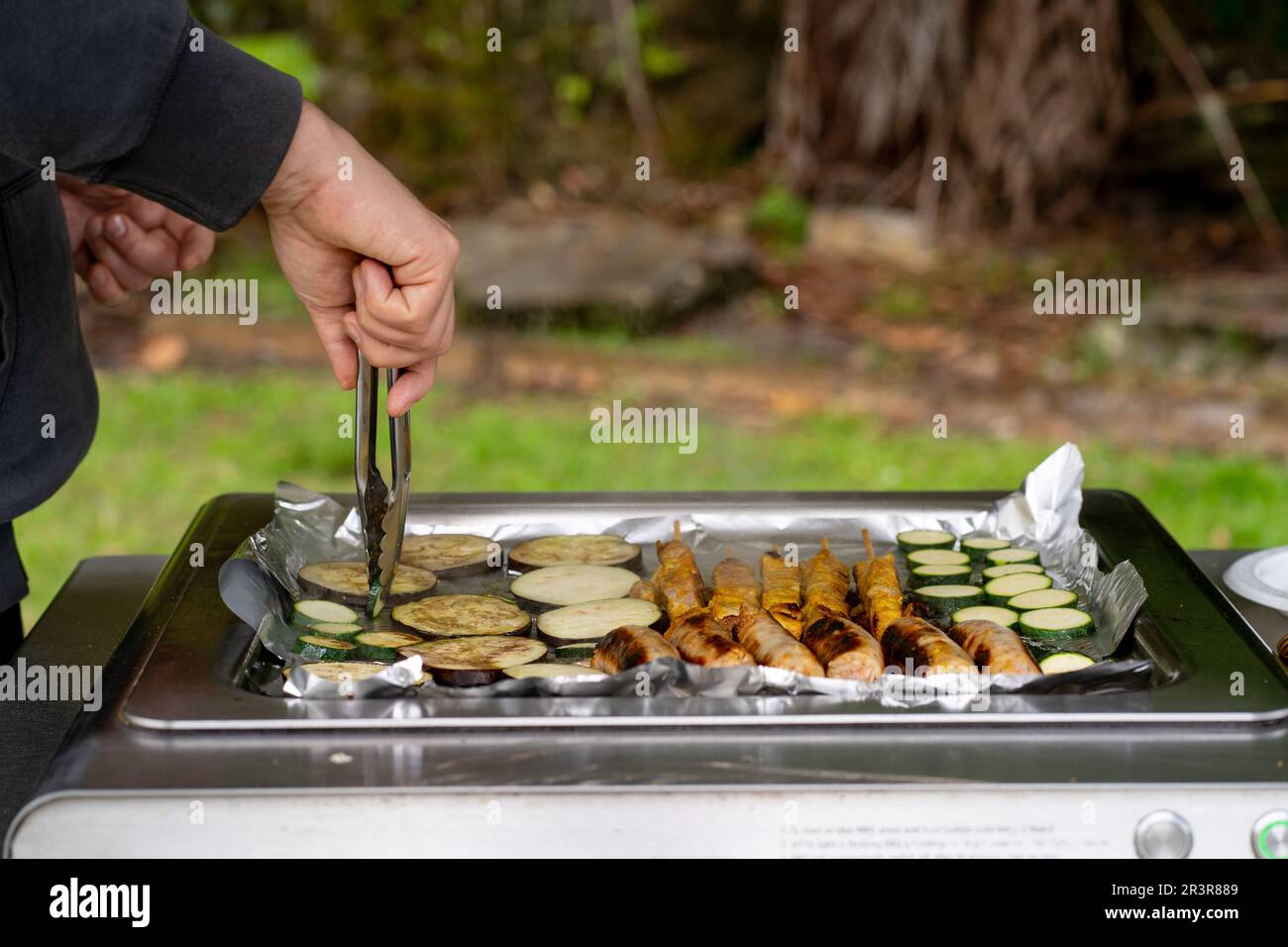 Cooking Barbecue in a public park Stock Photo - Alamy