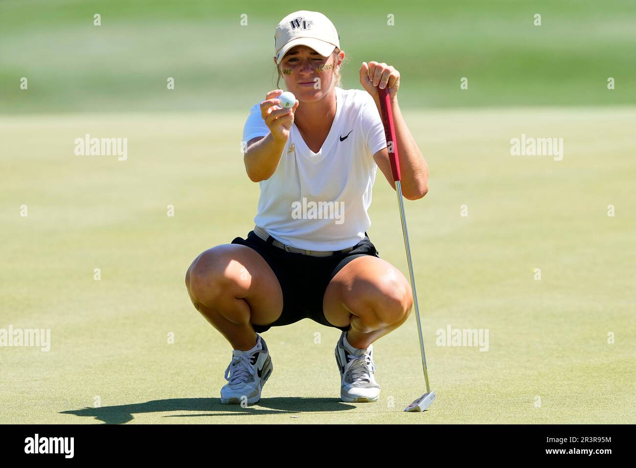 Wake Forest golfer Rachel Kuehn lines up her shot on the third green ...