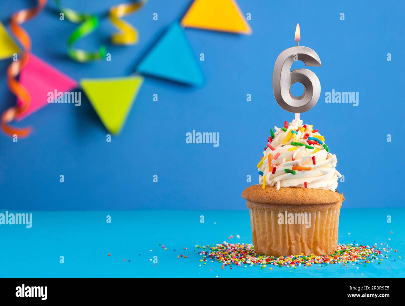 Candle number 6 - Cake birthday in blue background Stock Photo - Alamy
