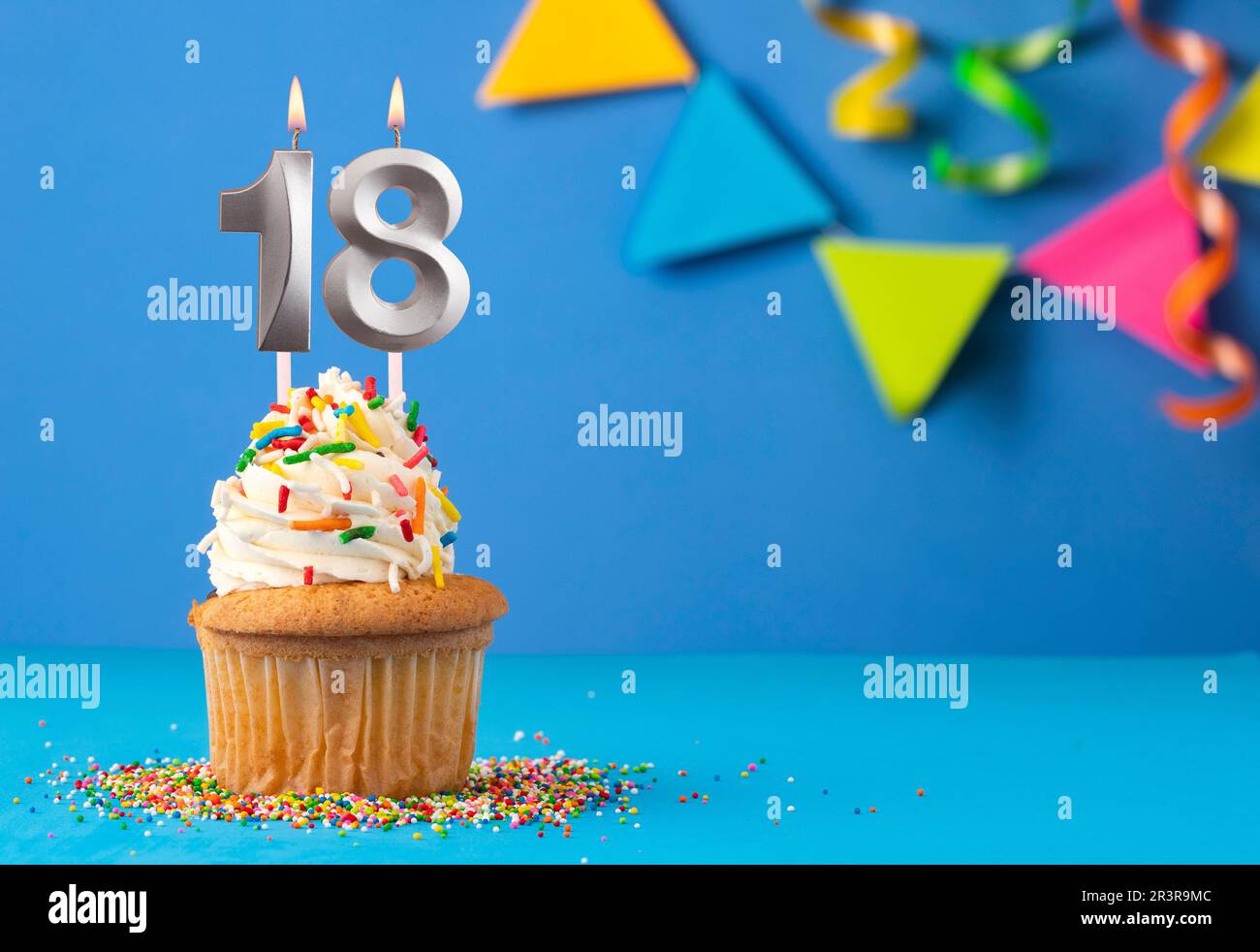 Candle number 18 - Cake birthday in blue background Stock Photo - Alamy