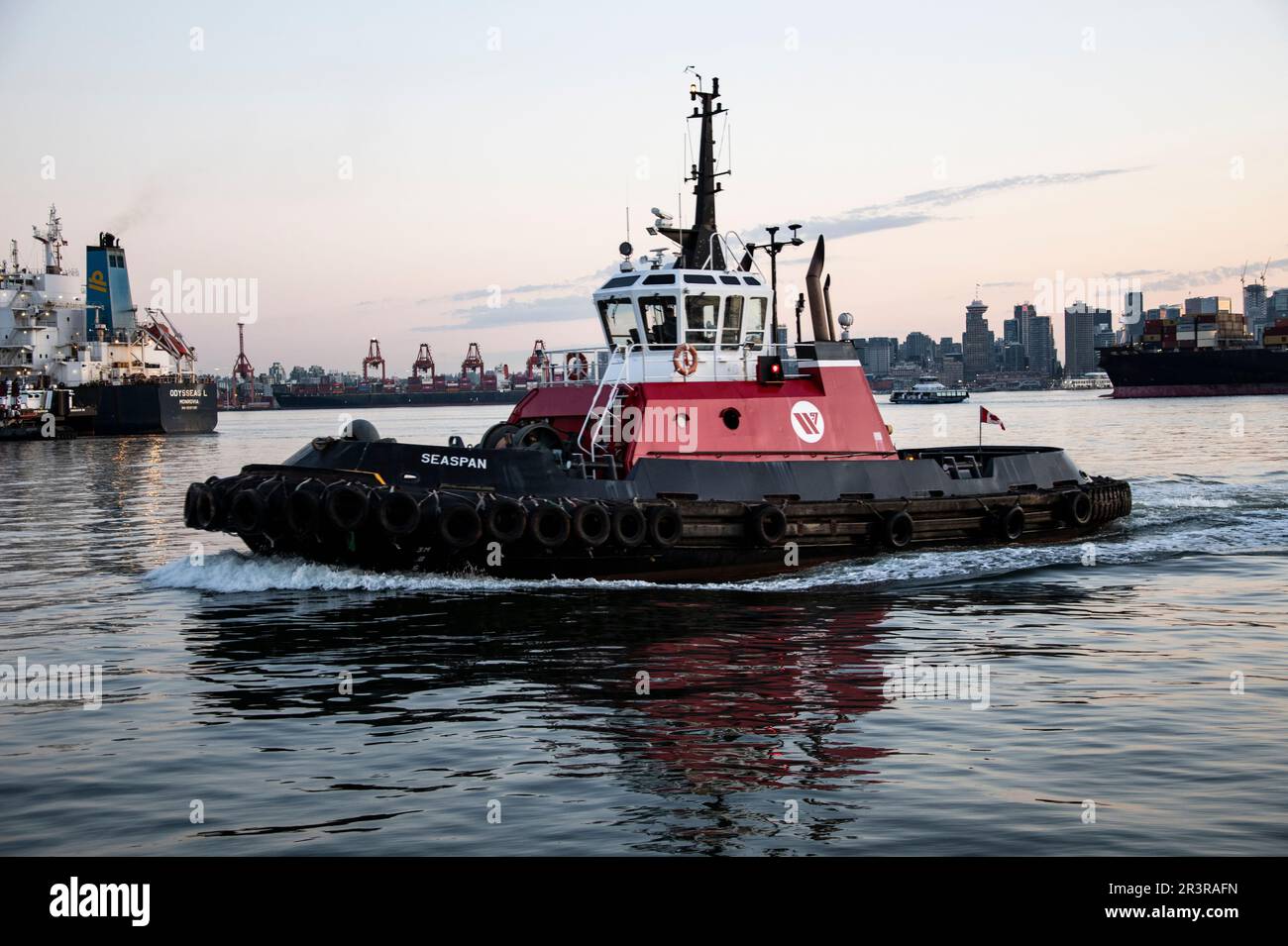 Tugboat passing by The Shipyards in North Vancouver, British Columbia, Canada Stock Photo - Alamy