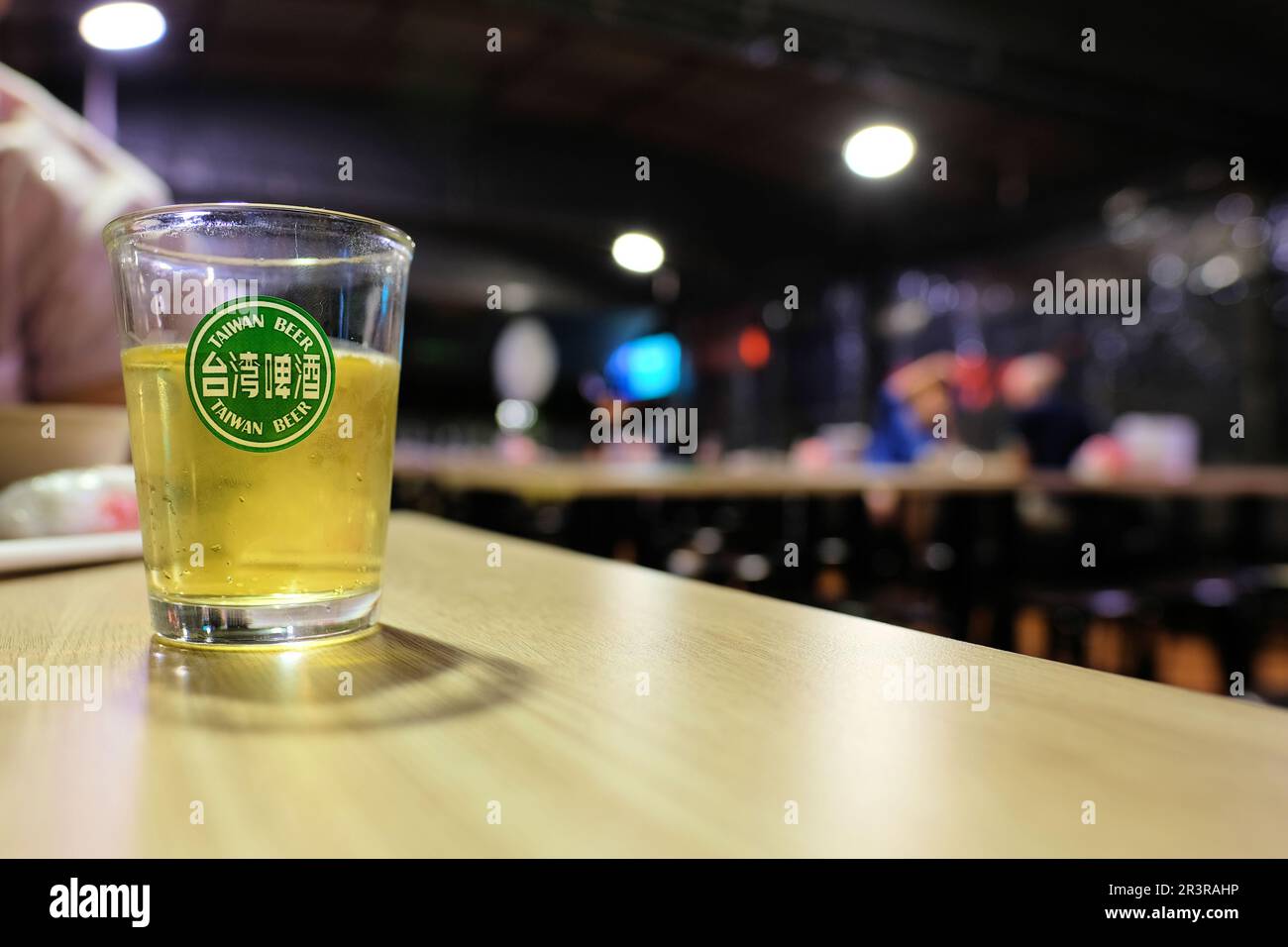 Taiwan Beer in a branded glass on a restaurant table in Taipei; brewed ...