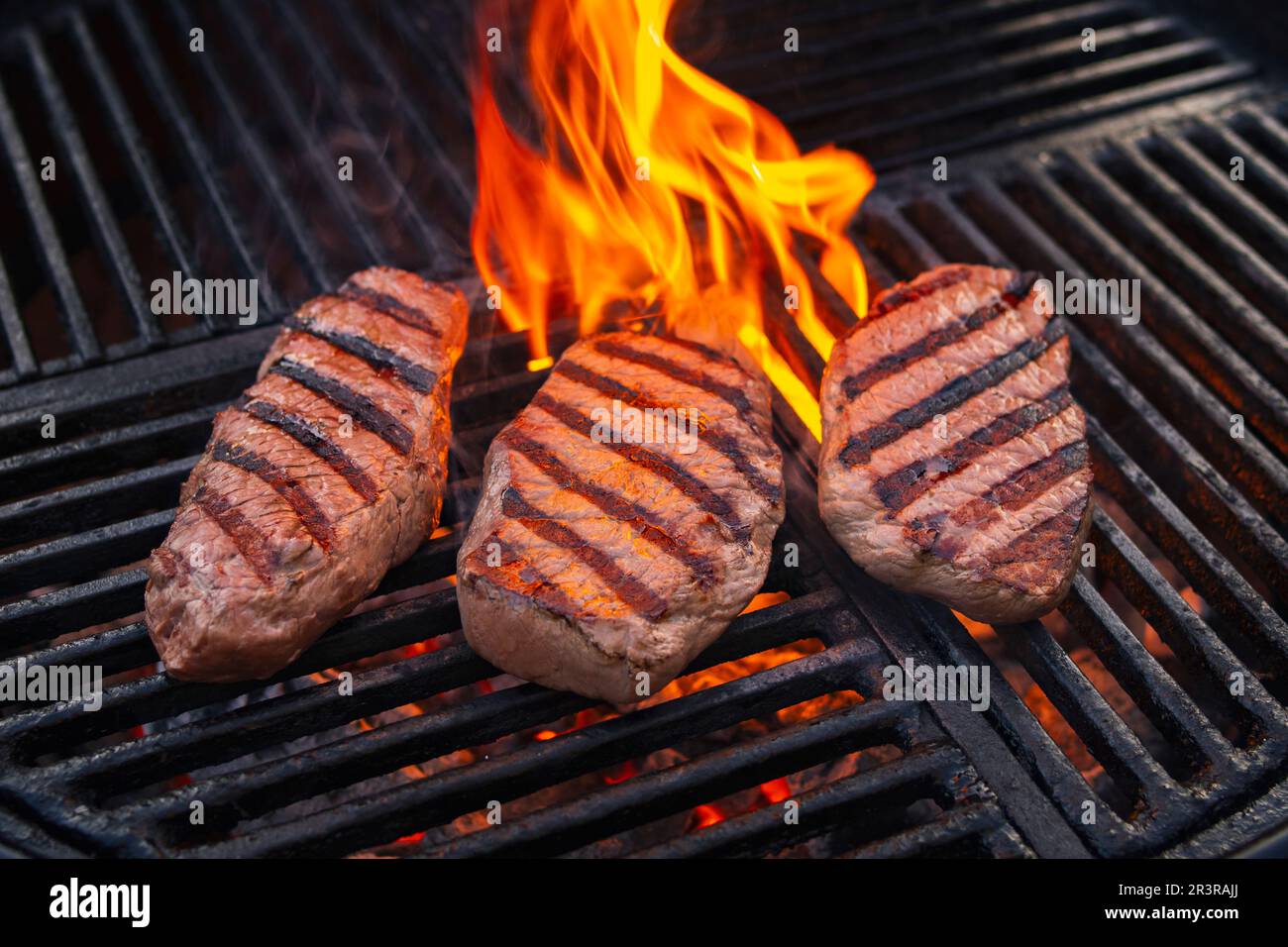 Barbecue dry aged angus sirloin beefsteak grilled as close-up on a ...