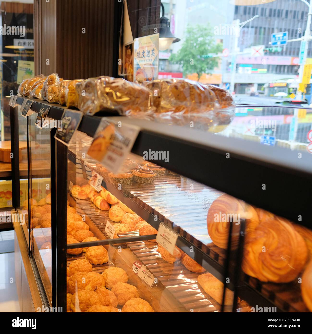 Trays and display cases of pastries and baked goods at a Sunmerry ...