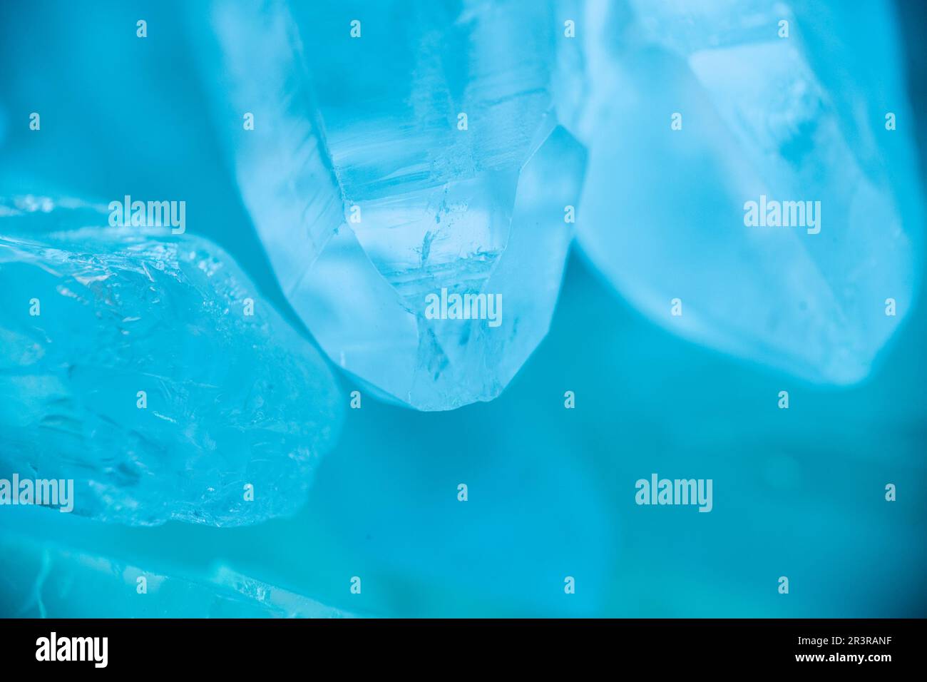 Rock crystal in blue light.transparent quartz crystals background in ...