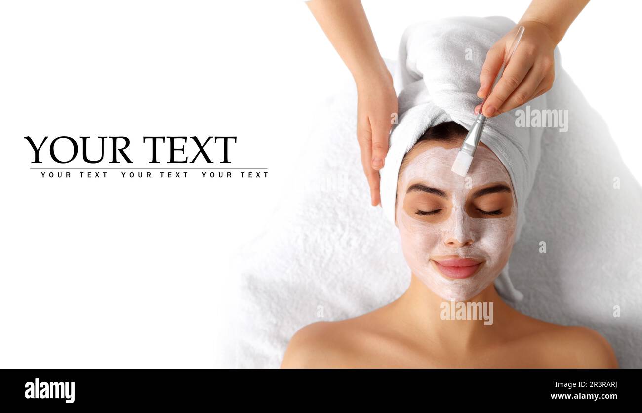 Cosmetologist applying mask on woman's face, top view. Spa salon ...