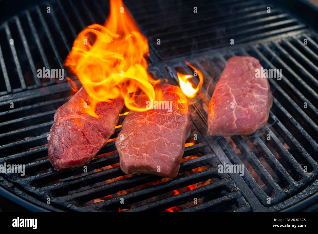 Barbecue dry aged angus sirloin beefsteak grilled as close-up on a ...