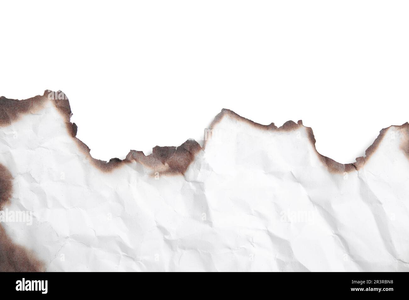 Piece of crumpled paper with dark burnt borders on white background ...