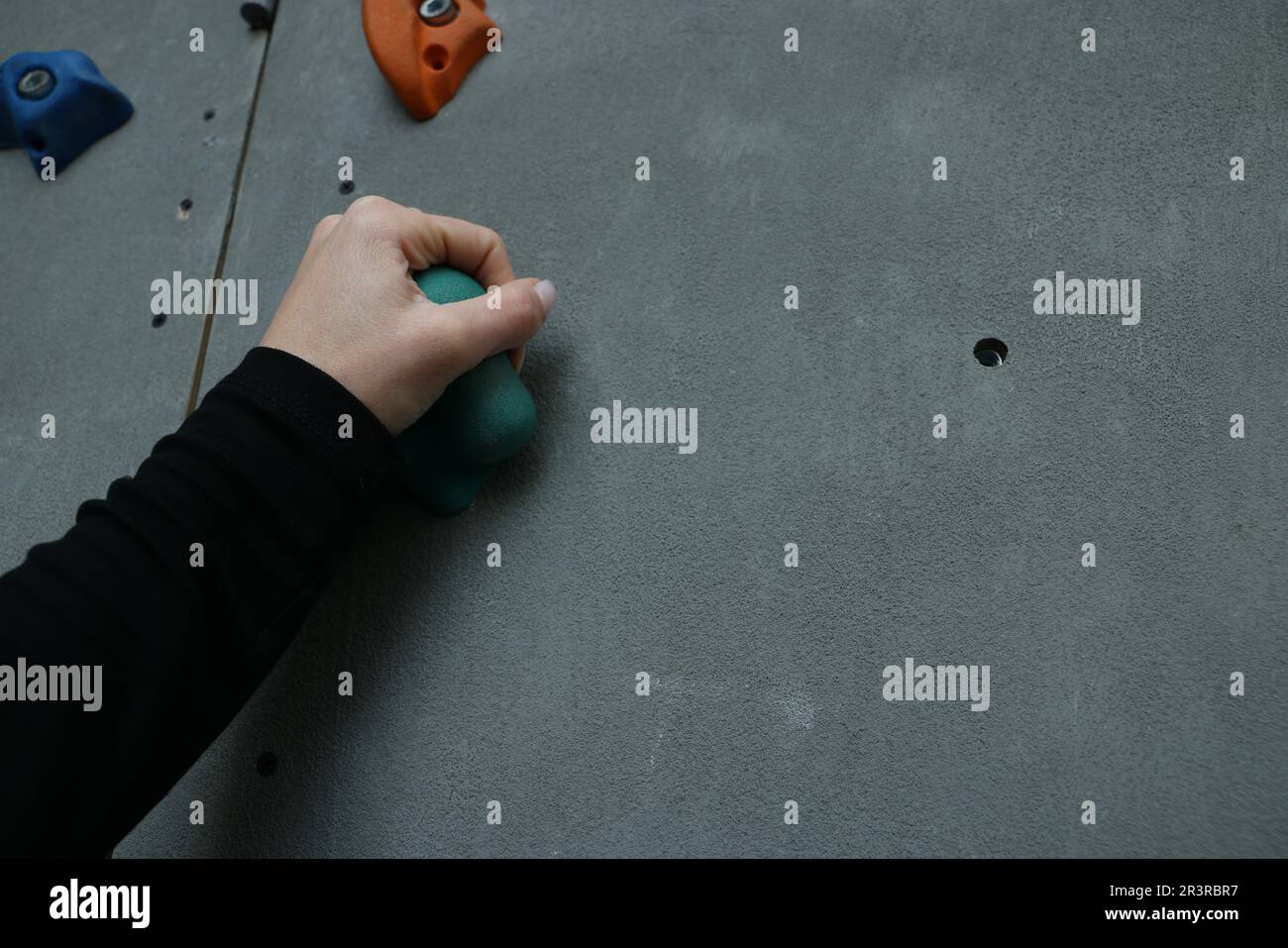 Woman climbing wall in hi-res stock photography and images - Alamy