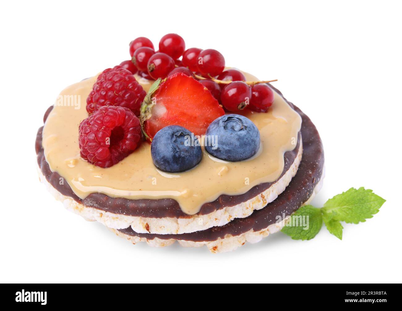 Crunchy rice cakes with peanut butter and sweet berries isolated on ...