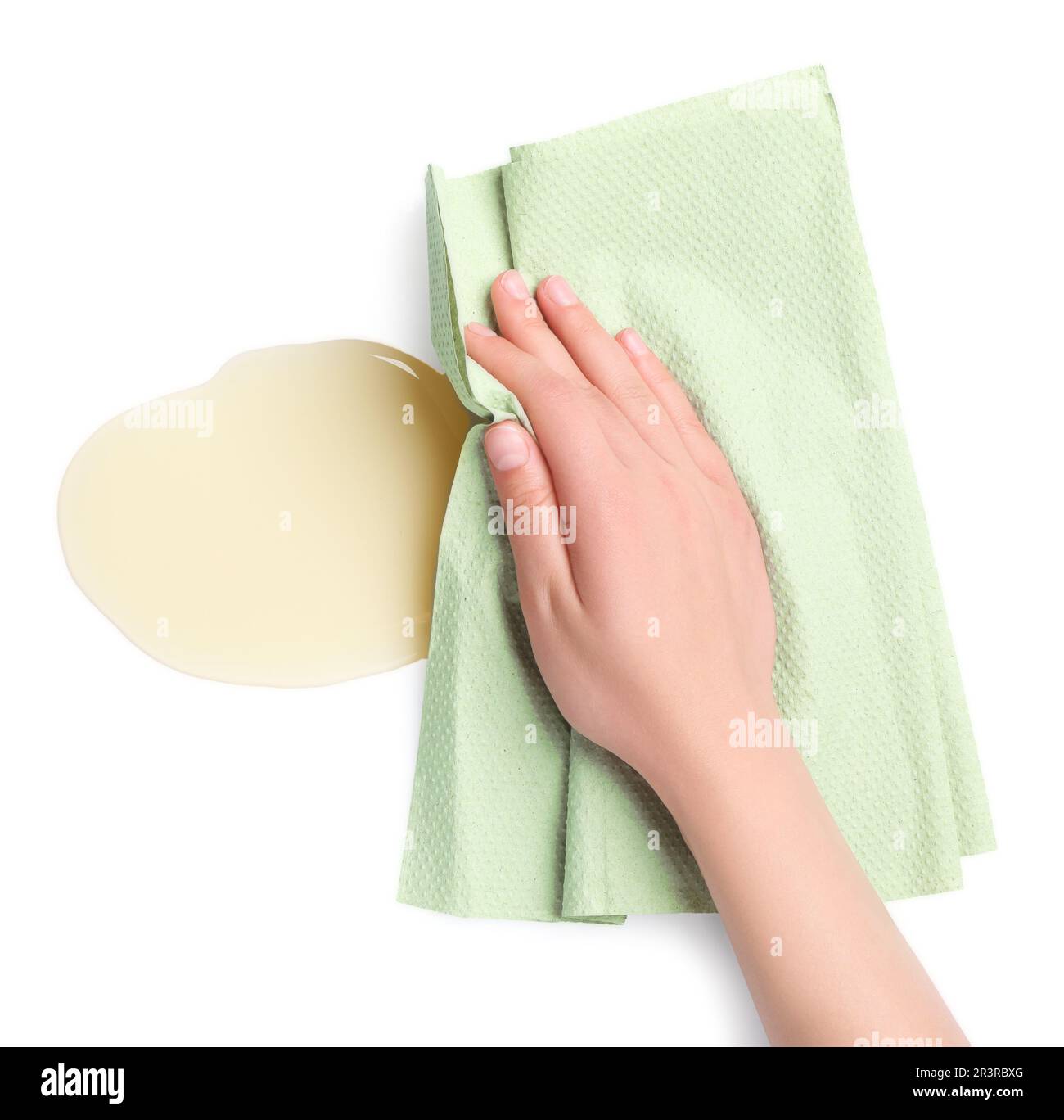 Woman wiping spilled oil on white background, top view Stock Photo - Alamy