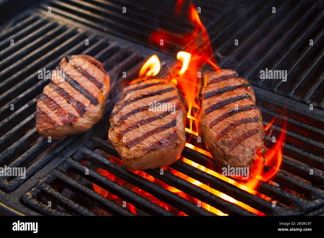 Barbecue dry aged angus sirloin beefsteak grilled as close-up on a ...
