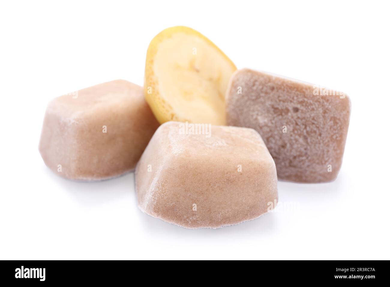 Frozen banana puree cubes and fruit on white background Stock Photo - Alamy