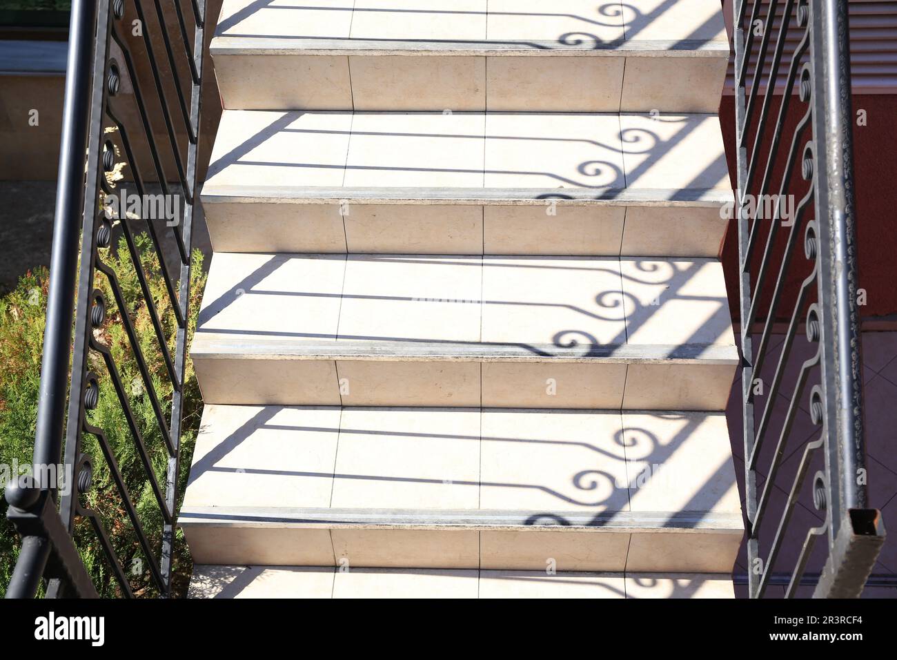 Beautiful stone stairs with metal handrails outdoors Stock Photo - Alamy