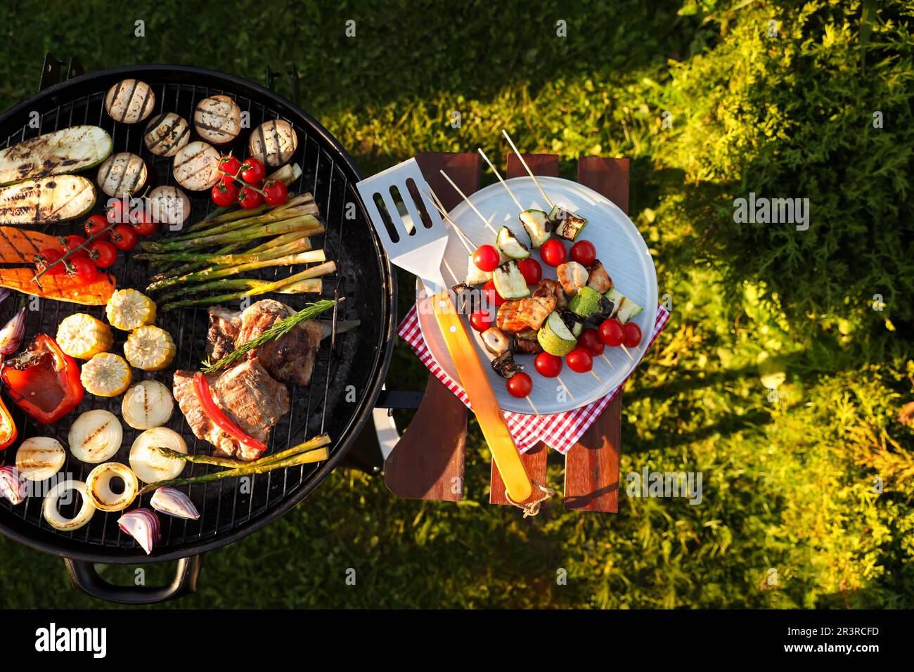 Cooked food products and grill barbecue outdoors, top view Stock Photo ...