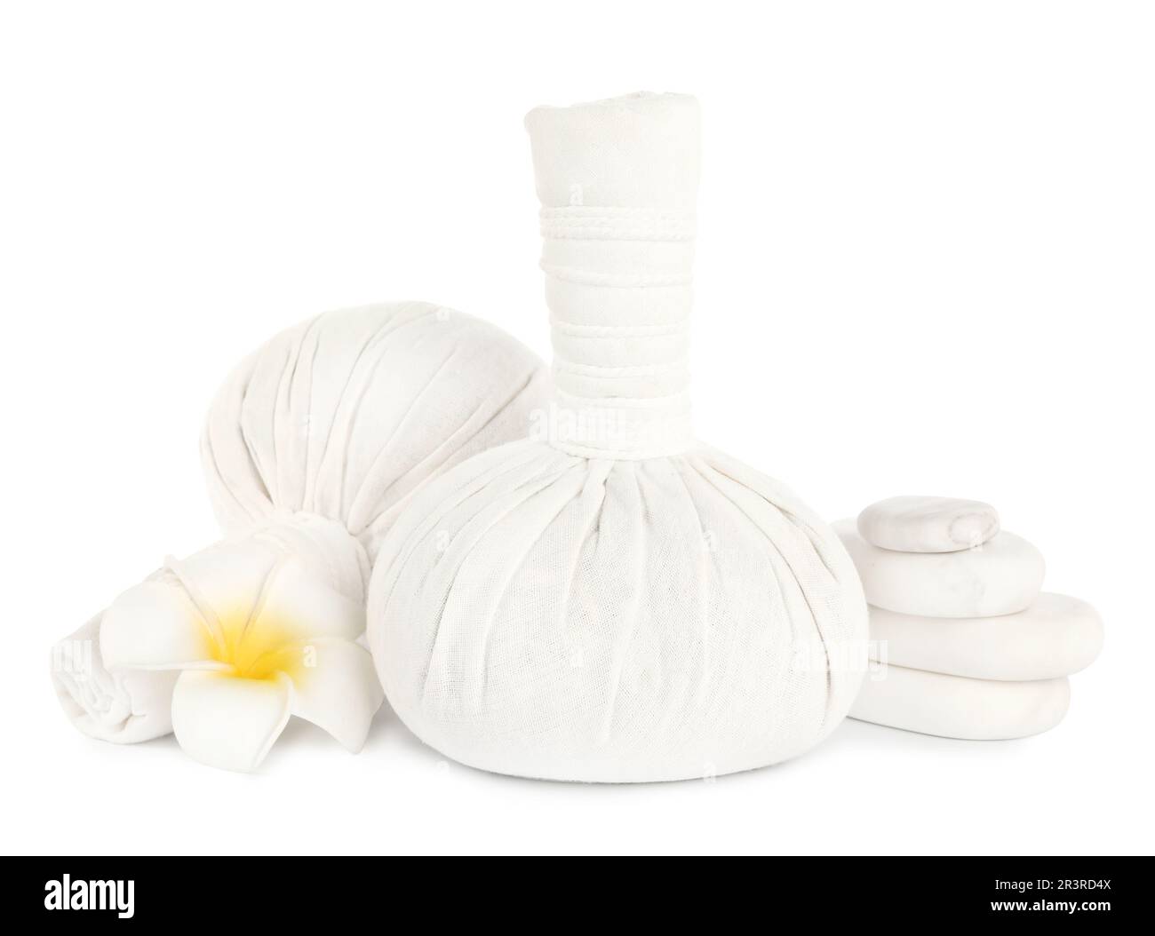 Herbal massage bags, flower and spa stones on white background Stock ...