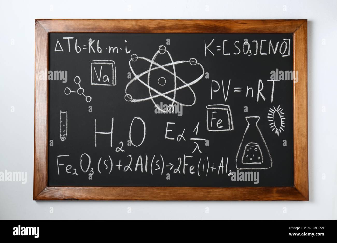 Blackboard with different chemical formulas written with chalk on white ...