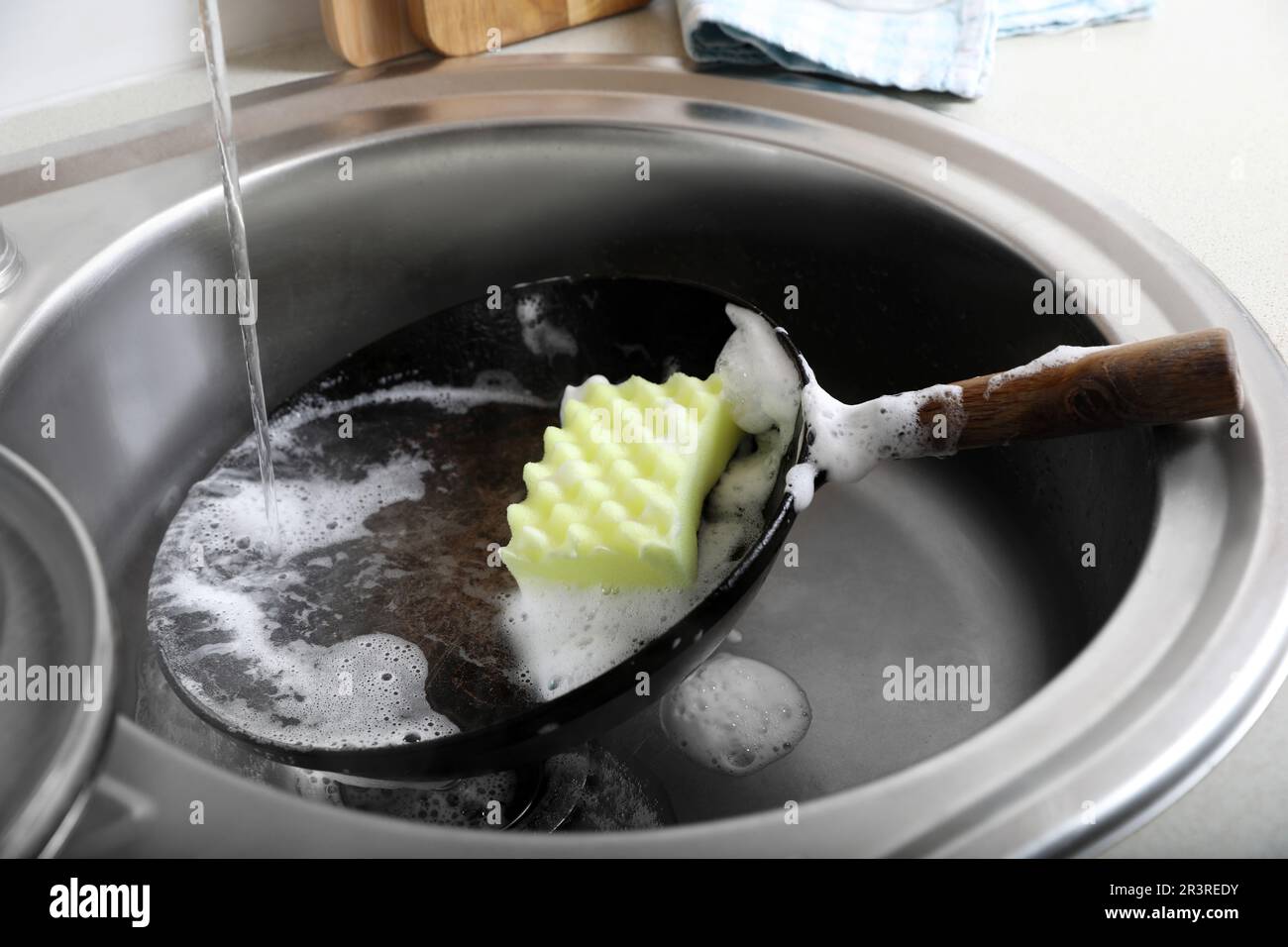 Dirty frying pan in kitchen sink hi-res stock photography and images ...