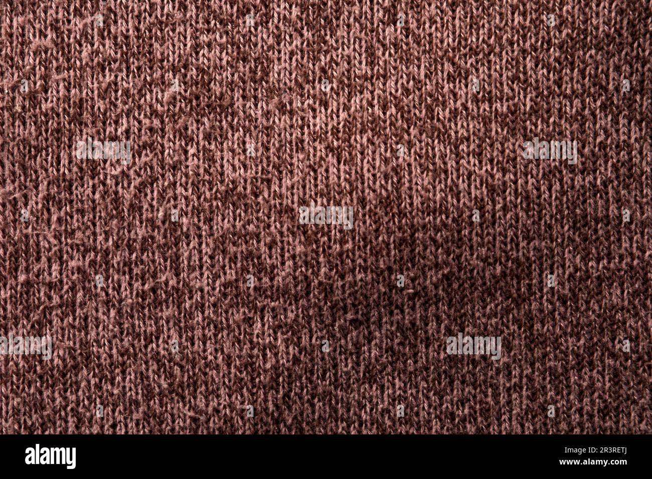 Knitted cloth with lint as background, top view. Before using of fabric ...