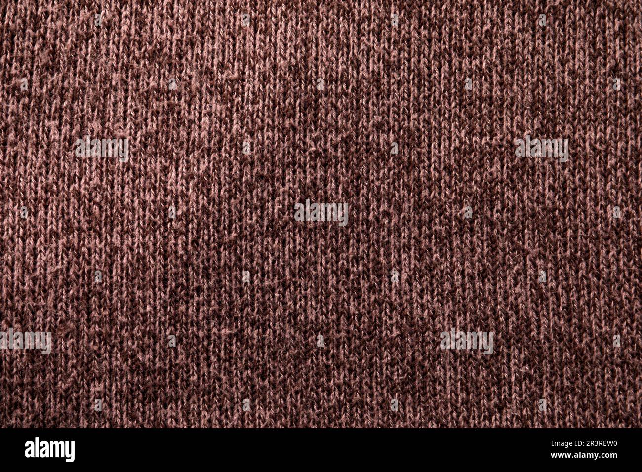 Knitted cloth with lint as background, top view. Before using of fabric ...