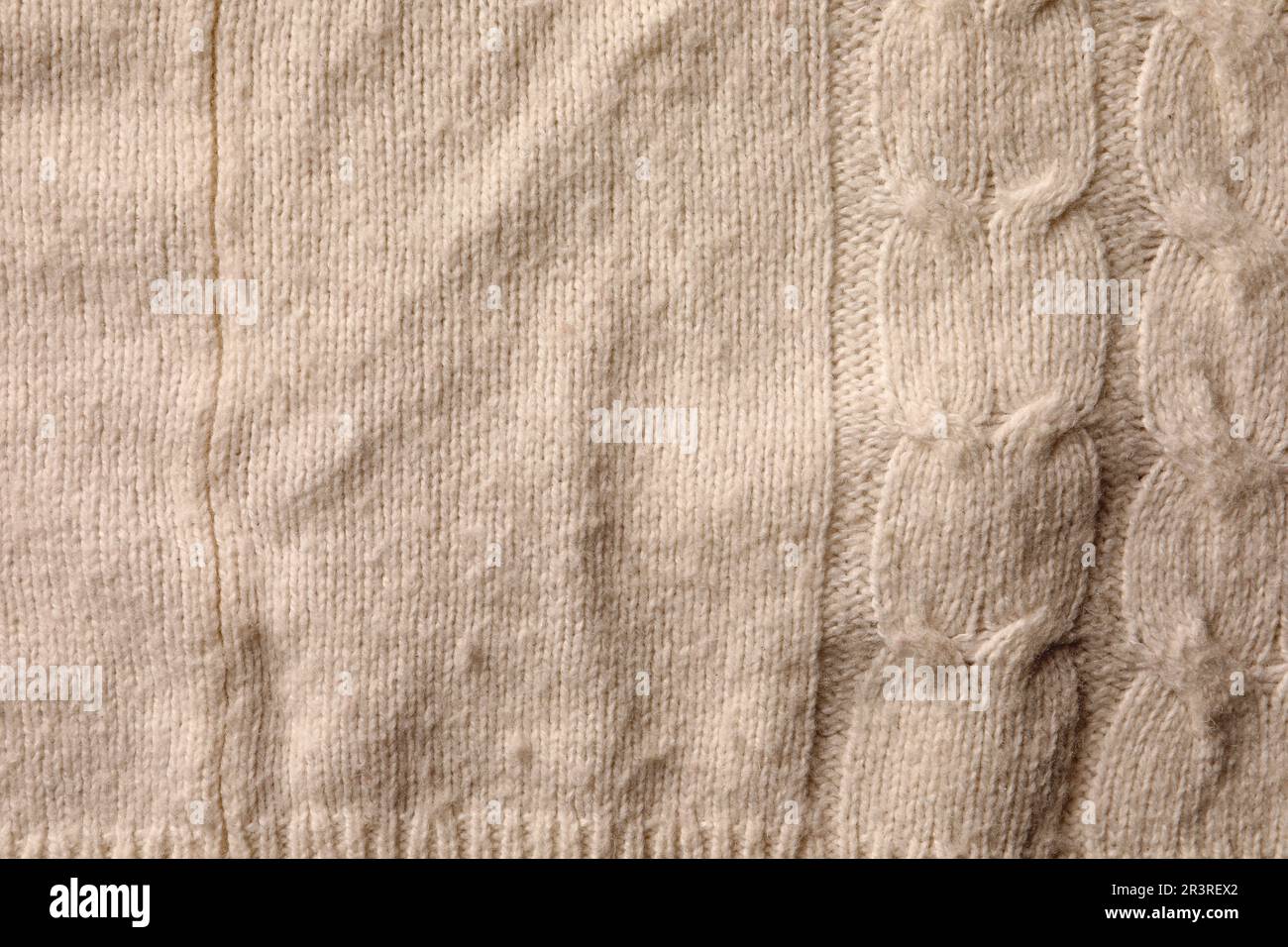 Knitted cloth with lint as background, top view. Before using of fabric ...