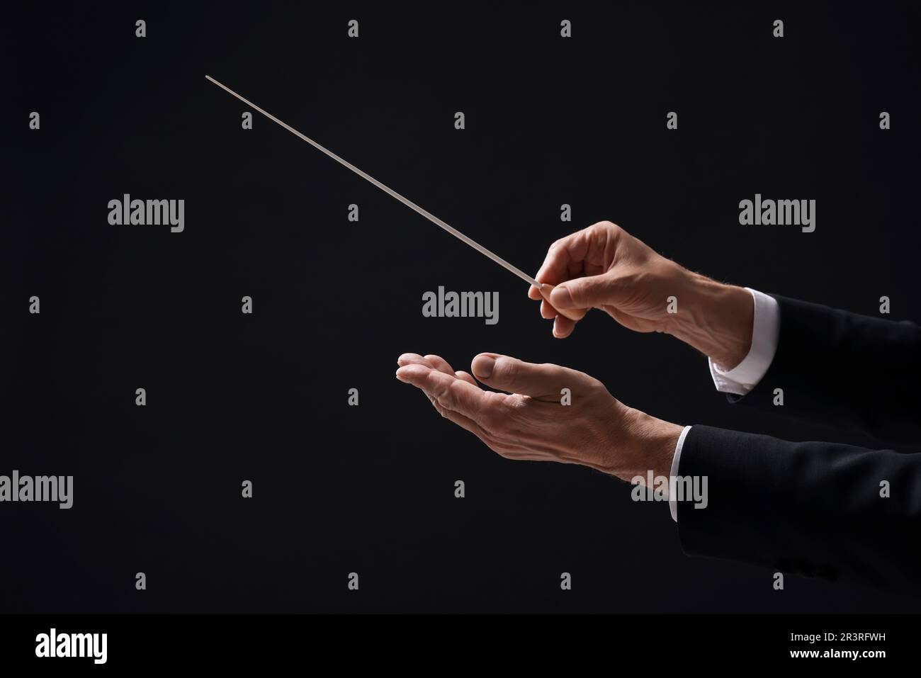 Professional conductor with baton on black background, closeup Stock ...