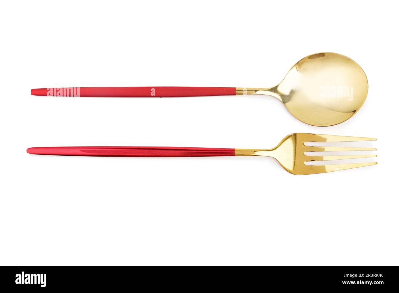 Golden spoon and fork with red handles on white background Stock Photo ...