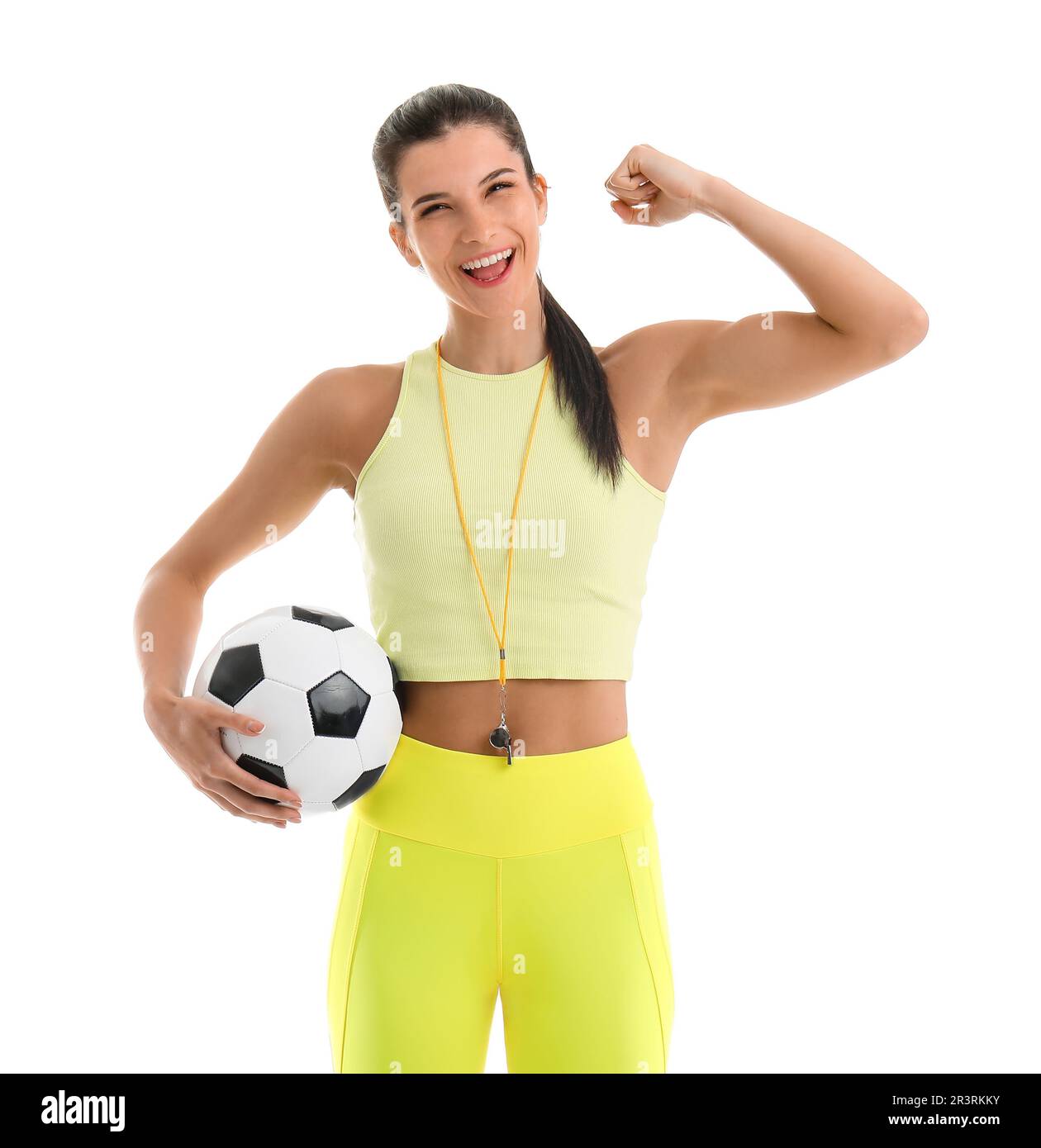 Sporty female coach with soccer ball on white background Stock Photo ...