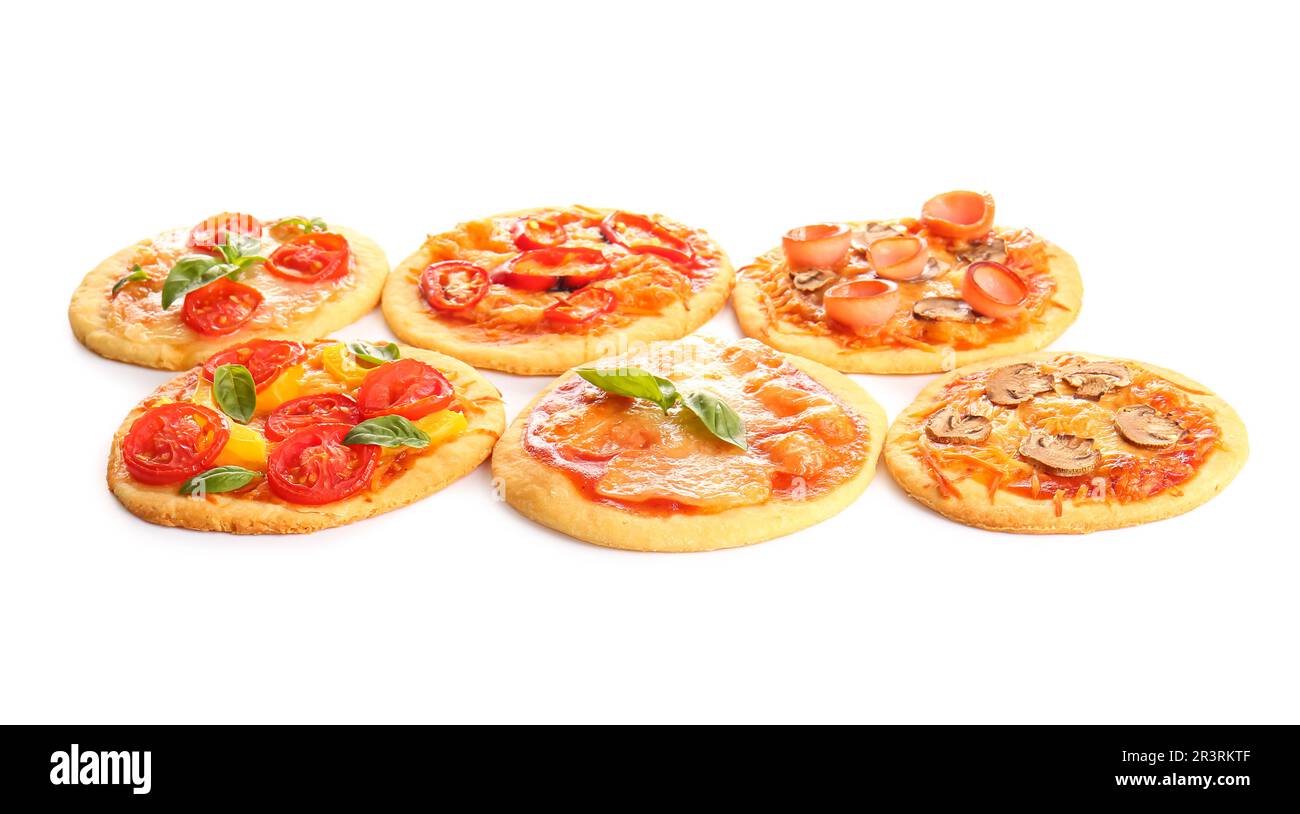 Different tasty mini pizzas on white background Stock Photo - Alamy