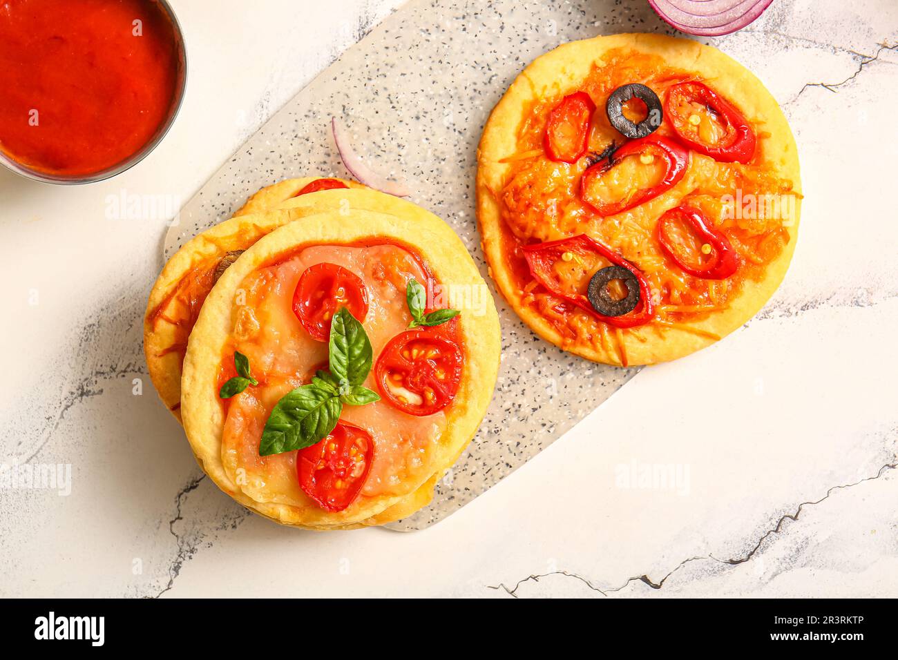 Board with different tasty mini pizzas on white background Stock Photo ...