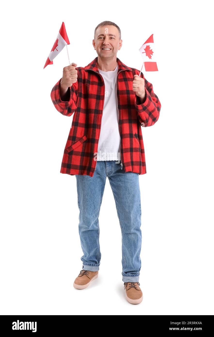Mature man with flags of Canada on white background Stock Photo - Alamy