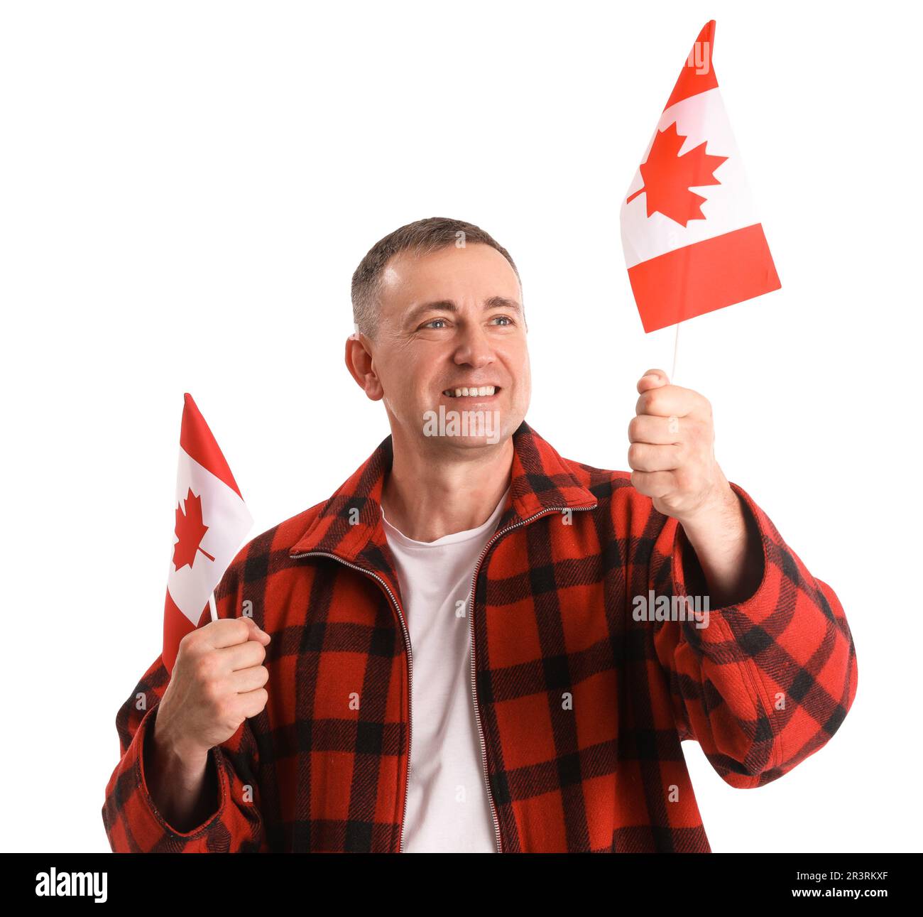 Mature man with flags of Canada on white background Stock Photo - Alamy