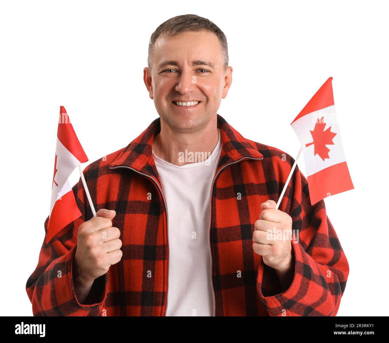 Mature man with flags of Canada on white background Stock Photo - Alamy