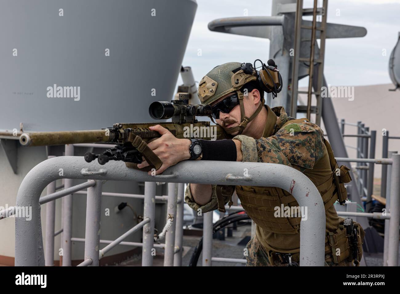 A U.S. Marine with the 26th Marine Expeditionary Unit, sights in on a ...