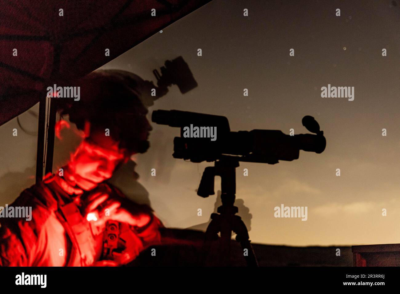 A U.S. Marine identifies targets through a spotter’s scope during an ...