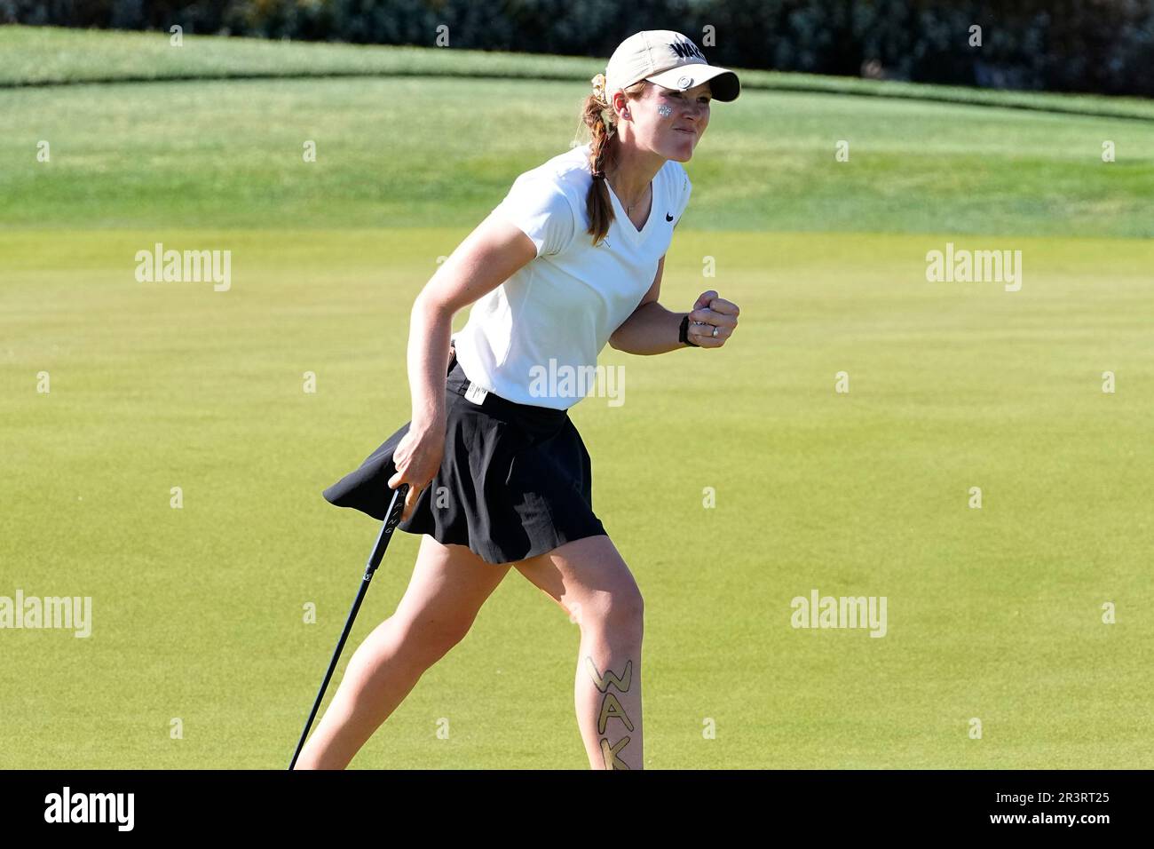Wake Forest golfer Emilia Migliaccio celebrates winning the 15th hole ...