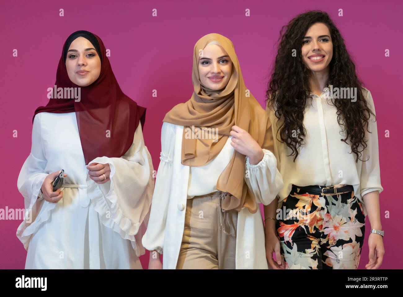 Group portrait of beautiful muslim women two of them in fashionable ...