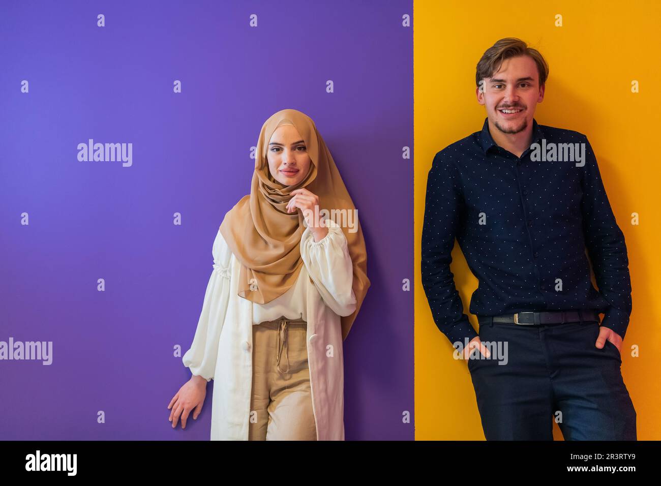 Portrait of young muslim couple woman in fashionable dress with hijab ...